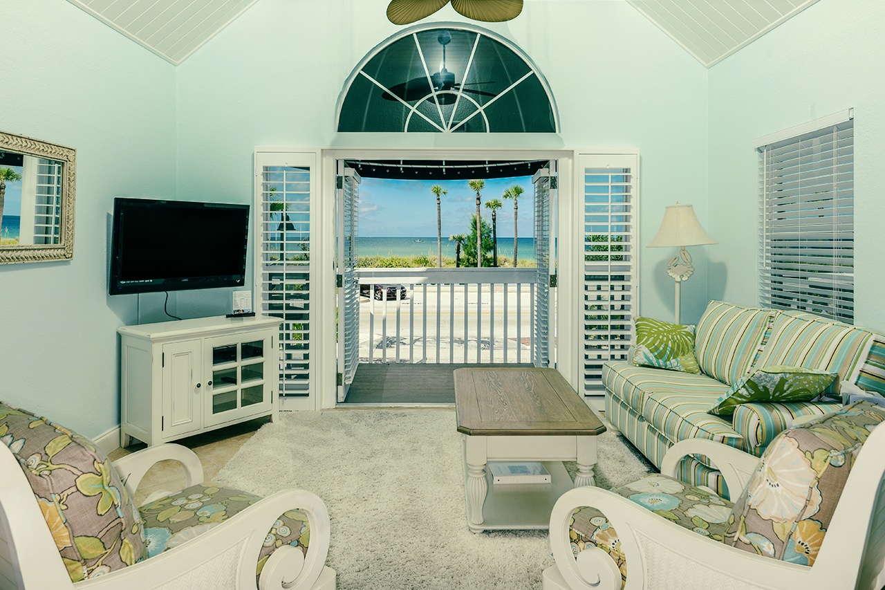 seating area in green with beach view