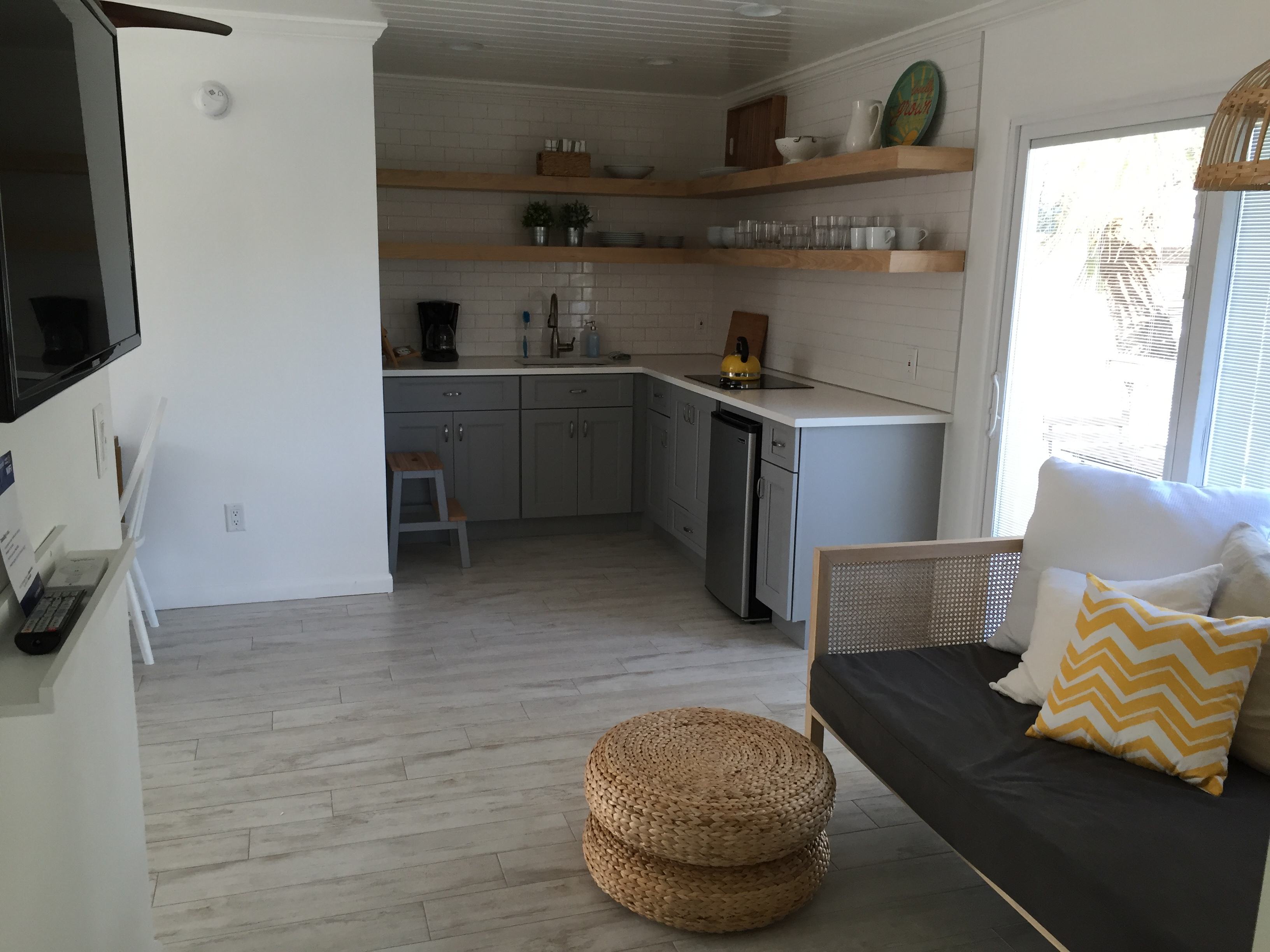 sofa with tv and kitchenette